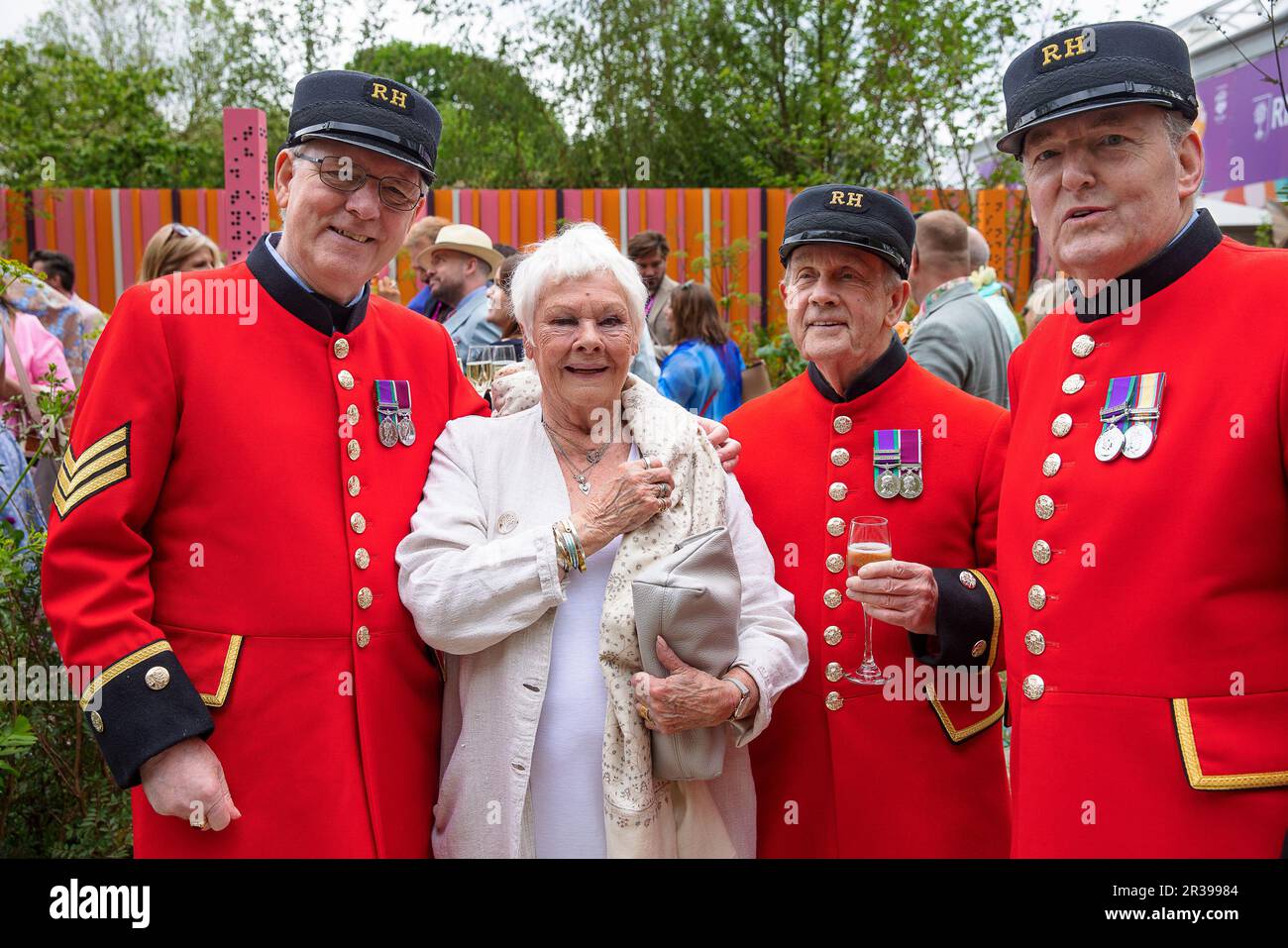 London, UK. 22nd May, 2023. Dame Judi Dench shares a joke with three of ...