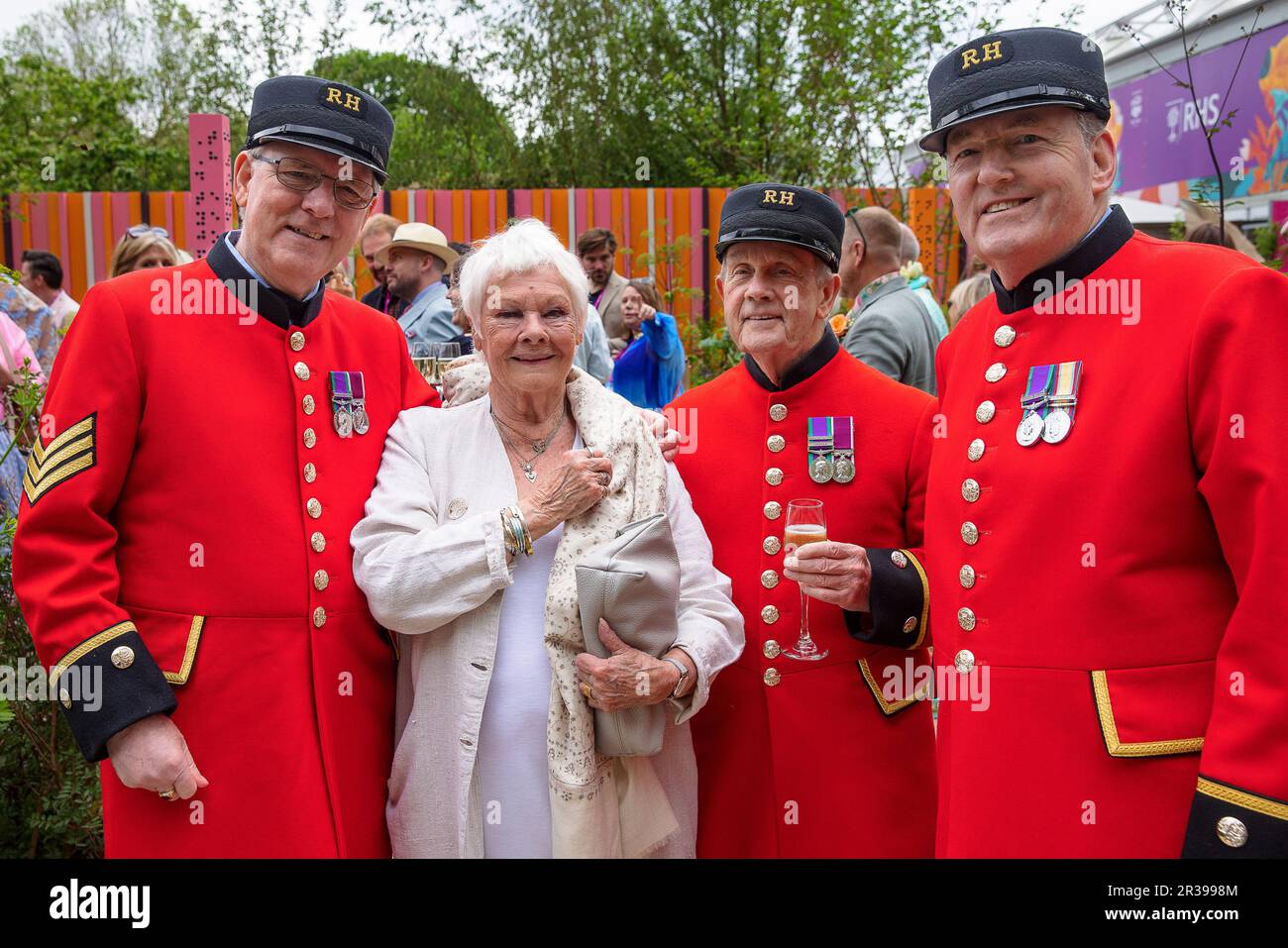 London, UK. 22nd May, 2023. Dame Judi Dench shares a joke with three of ...