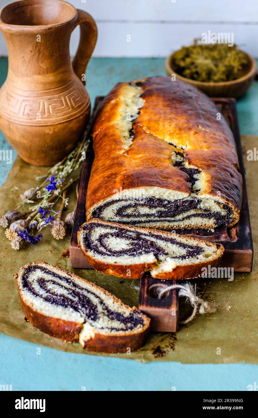 Poppy roll in a rustic style Stock Photo - Alamy