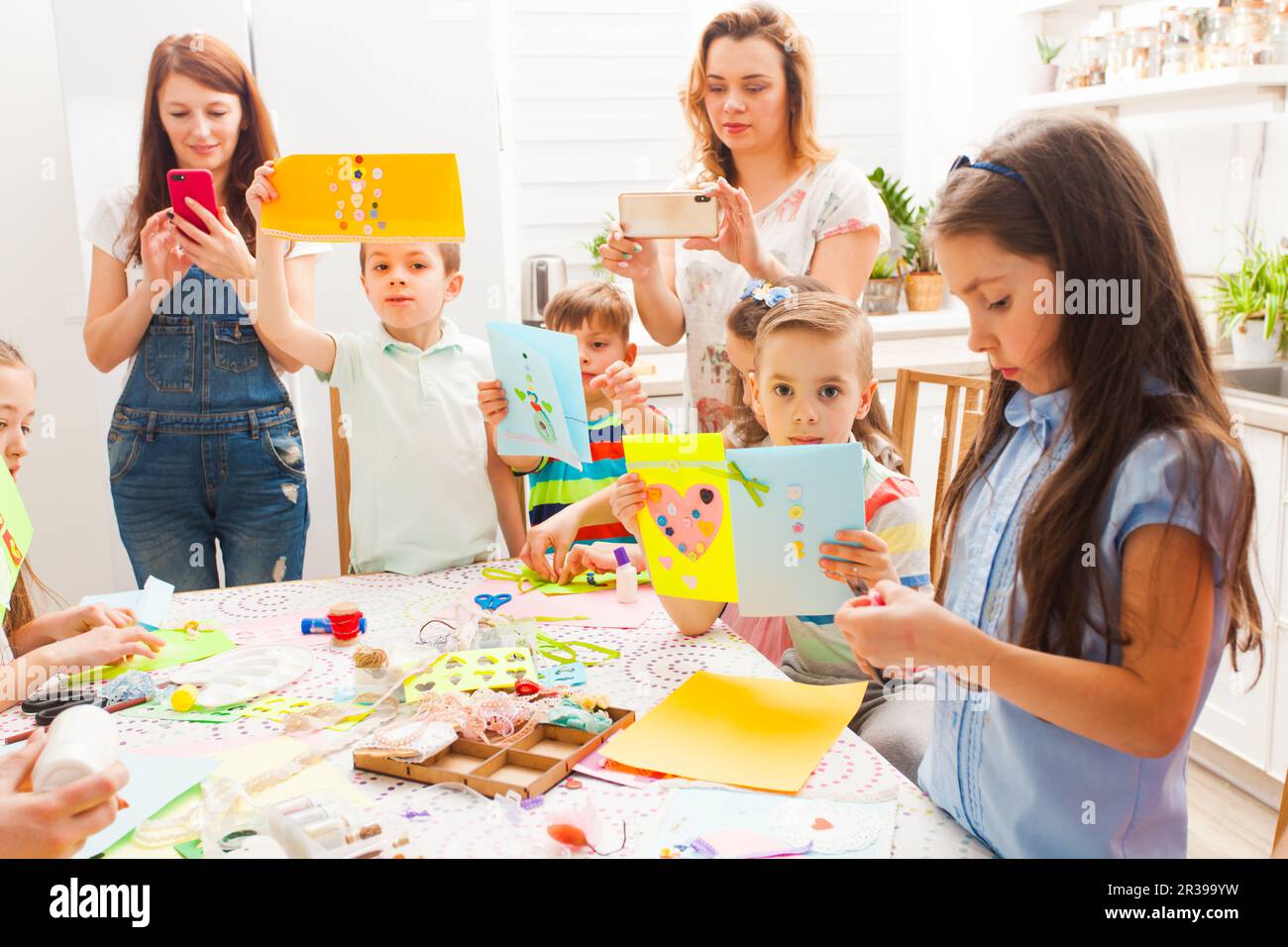 Paper crafts for kids idea. Kids doing greeting card Stock Photo - Alamy