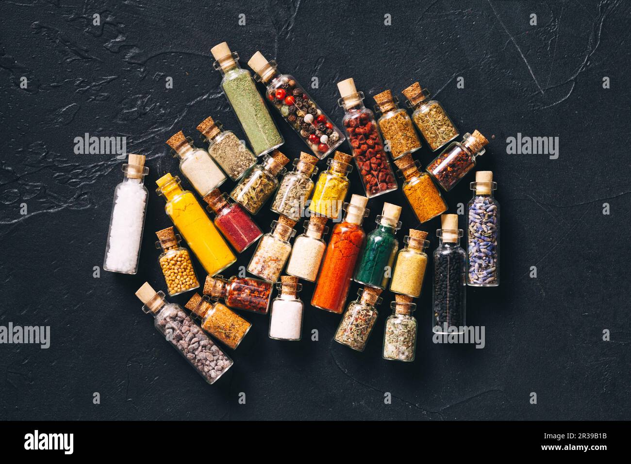 Assorted ground spices in bottles top view Stock Photo - Alamy