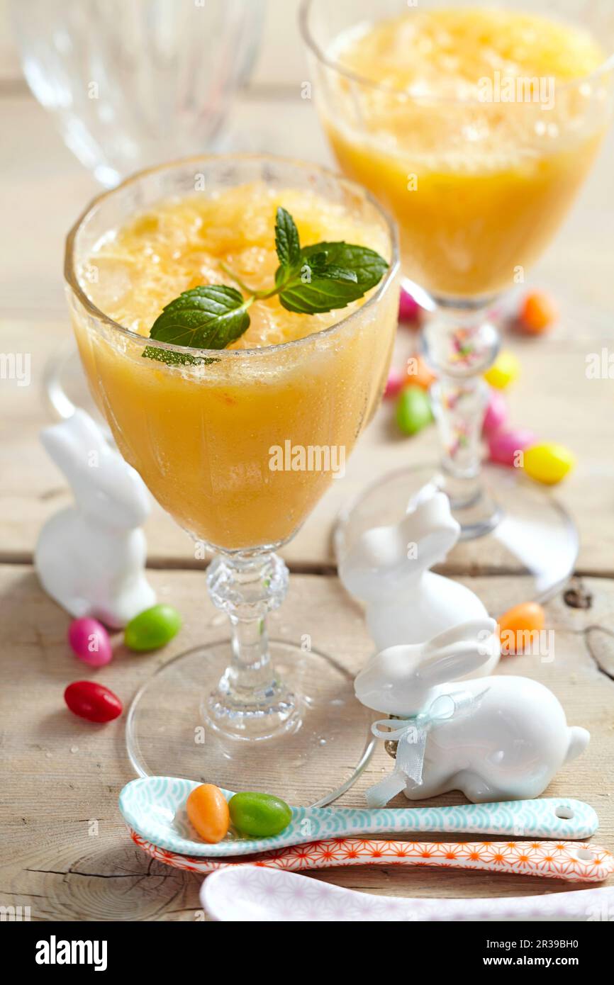 Carrot and orange smoothie with yoghurt and honey for Easter Stock ...