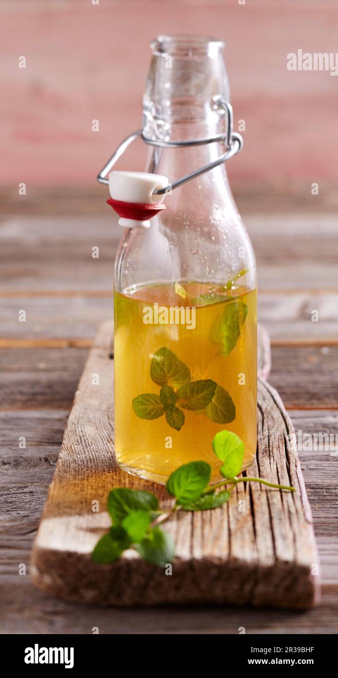 Homemade carrot liqueur in a flip-top bottle Stock Photo - Alamy