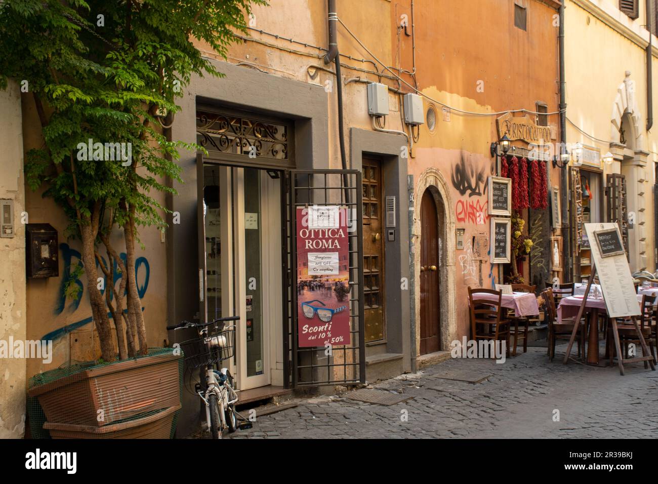 Backstreet in Rome with Restaurants Stock Photo - Alamy