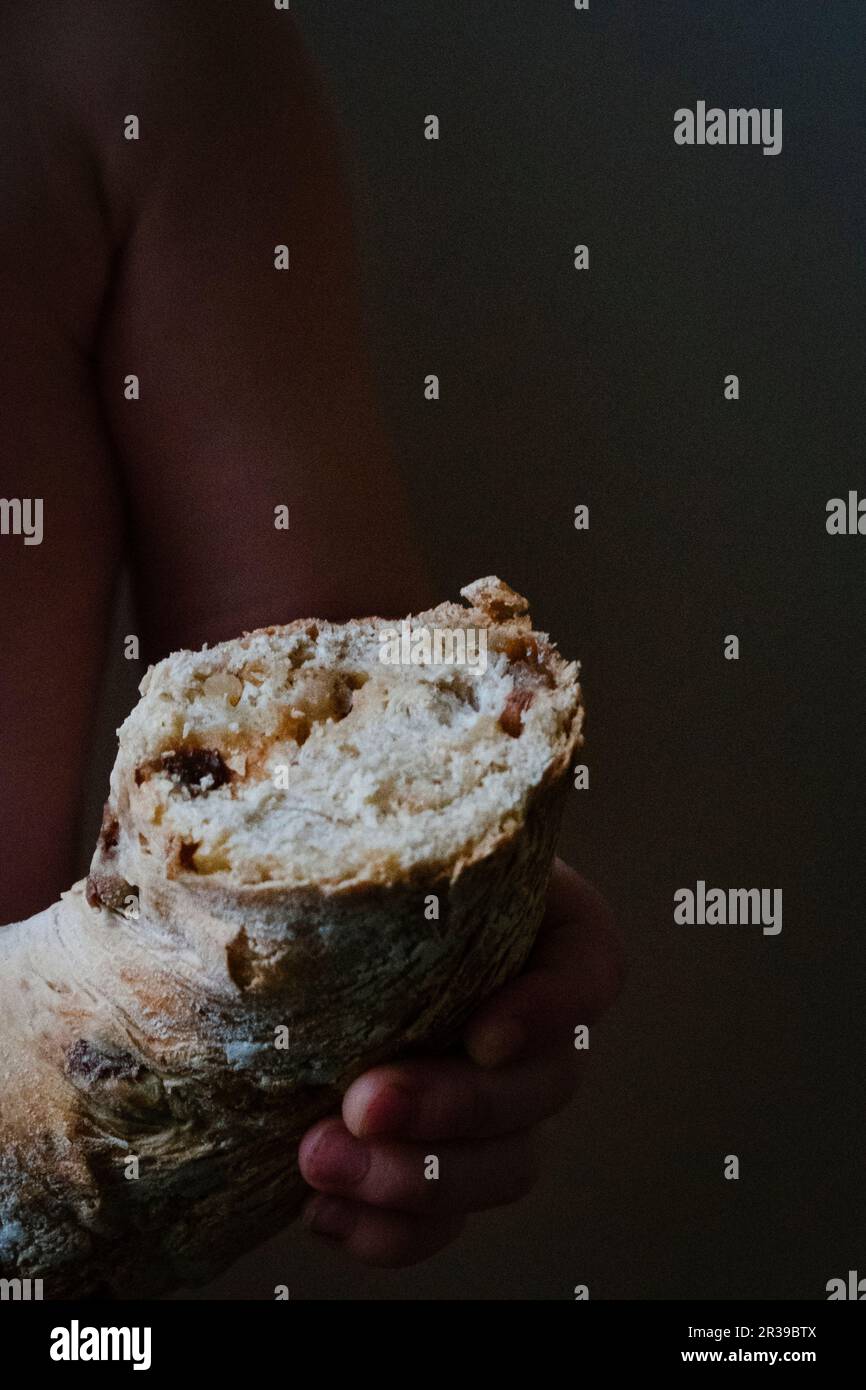 Child holding bread hi-res stock photography and images - Alamy