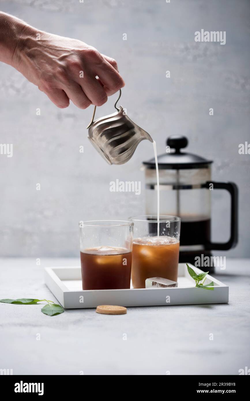 Woman pouring cold brew hi-res stock photography and images - Alamy