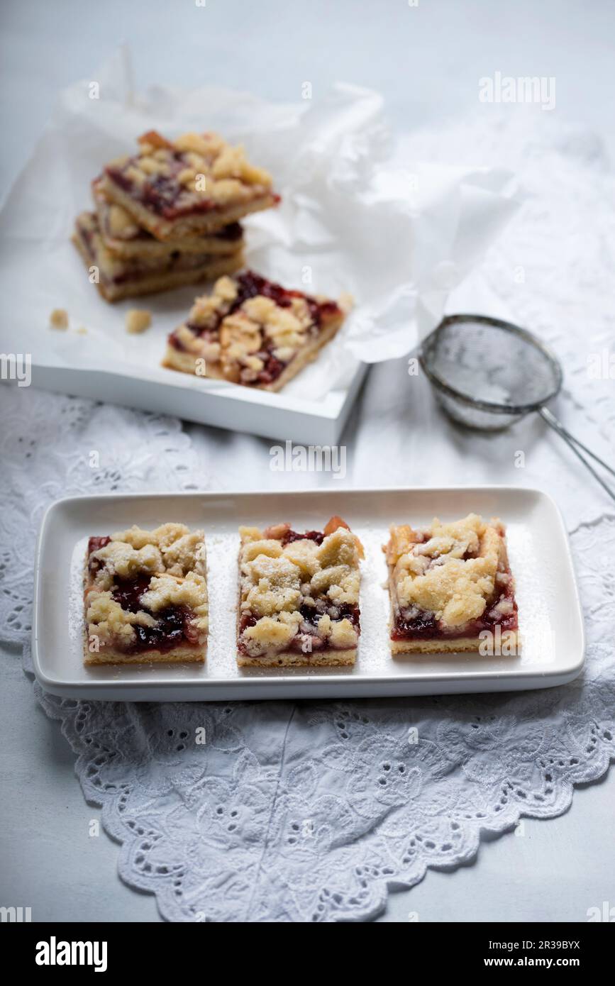 Vegan apple and lingon berry tray bake crumble cake Stock Photo - Alamy