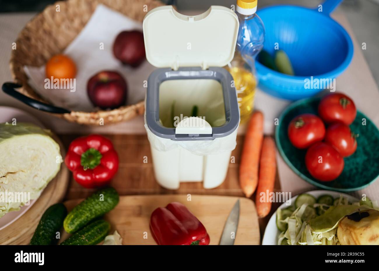 Compost bin with bokashi bran on a kitchen table. Sustainability and ...