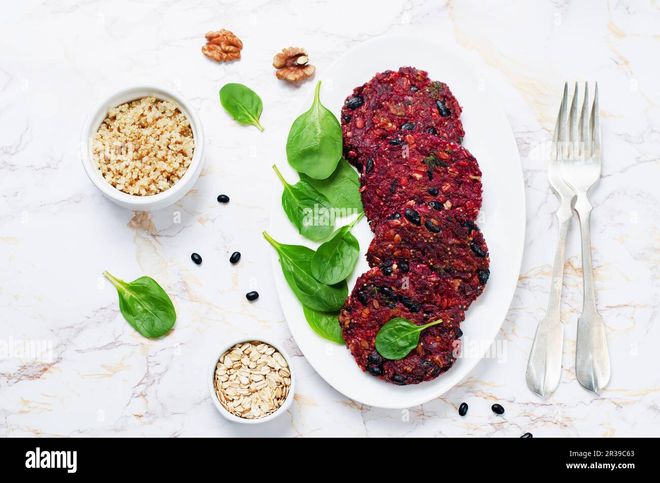 Beetroot and quinoa patties with black beans, walnuts and spinach Stock ...