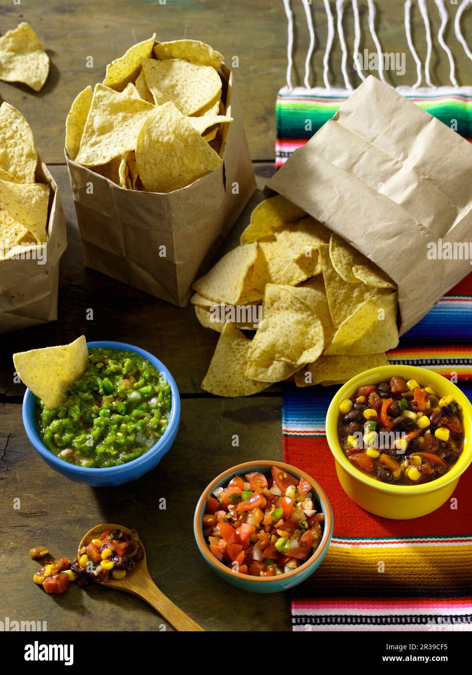Three bags of tortilla chips served with a trio of salsa (Mexico Stock ...