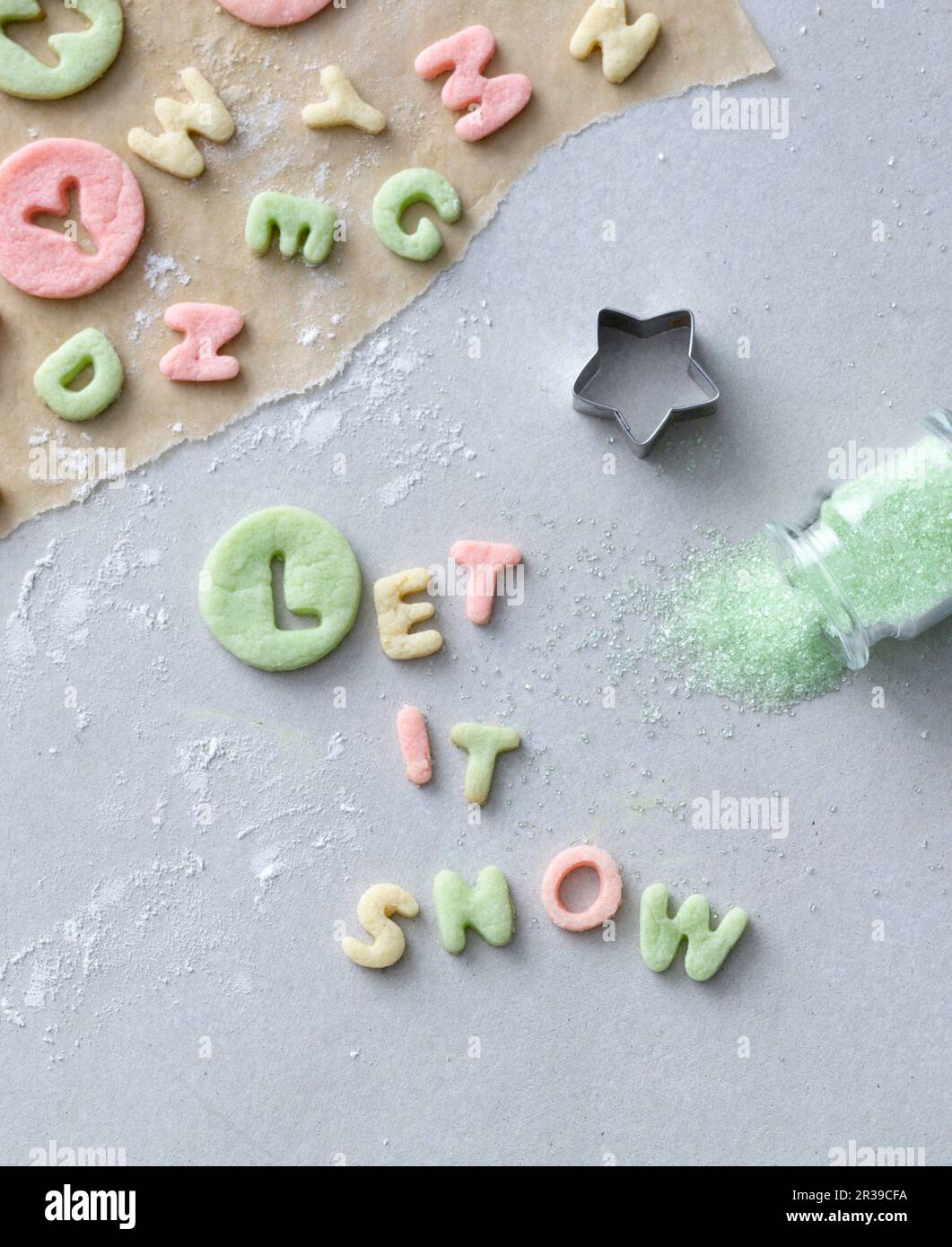 The words 'Let it snow' cut out of colourful pastry Stock Photo - Alamy