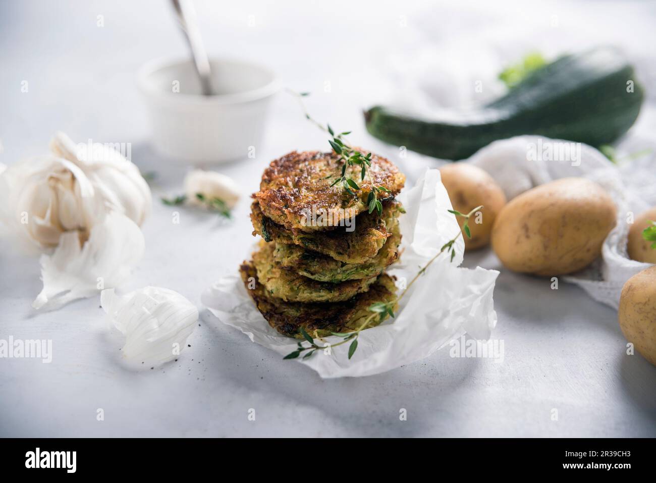 Vegan potato and courgette fritters Stock Photo - Alamy