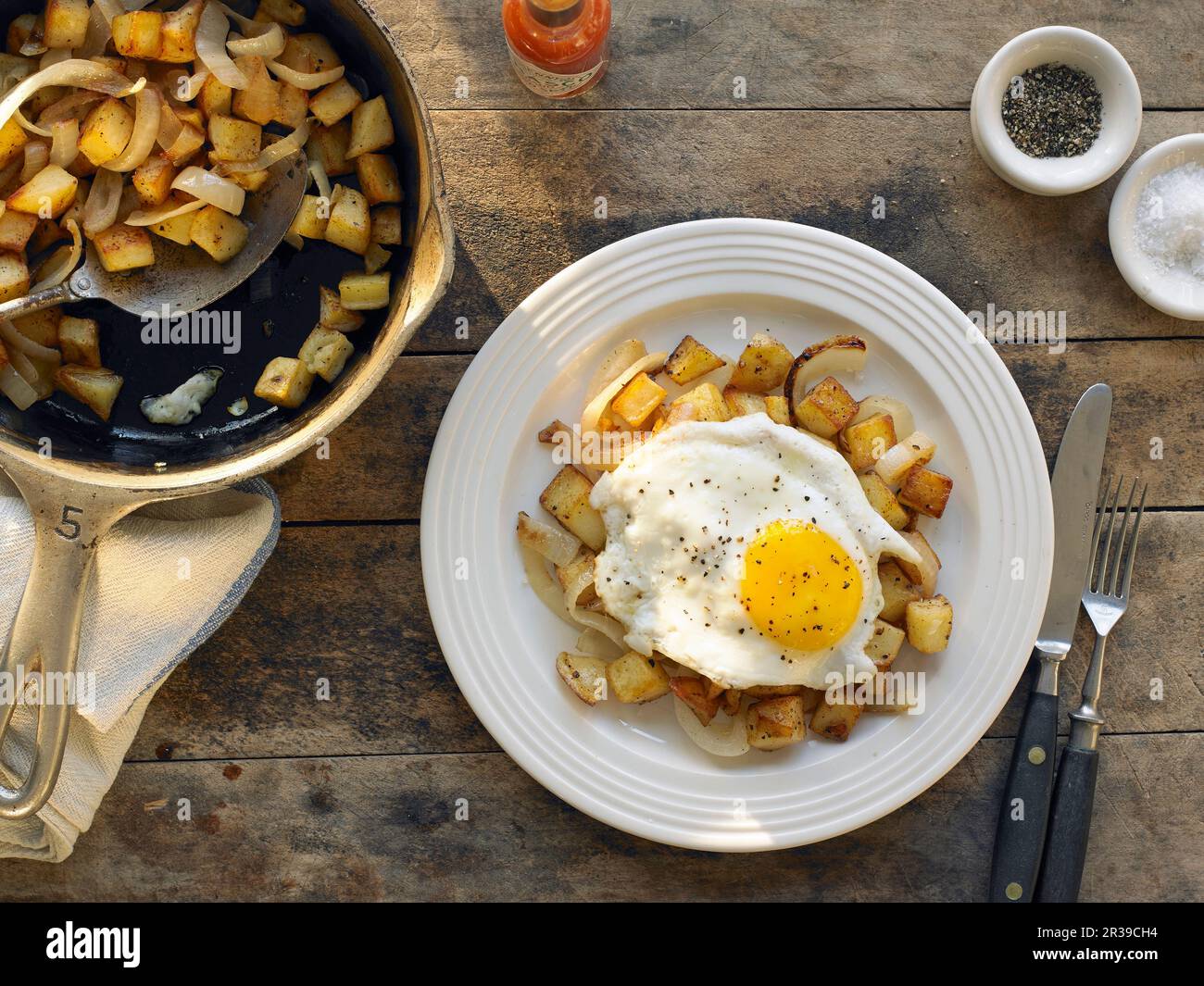 Potato Hash With a Fried Egg Stock Photo - Alamy