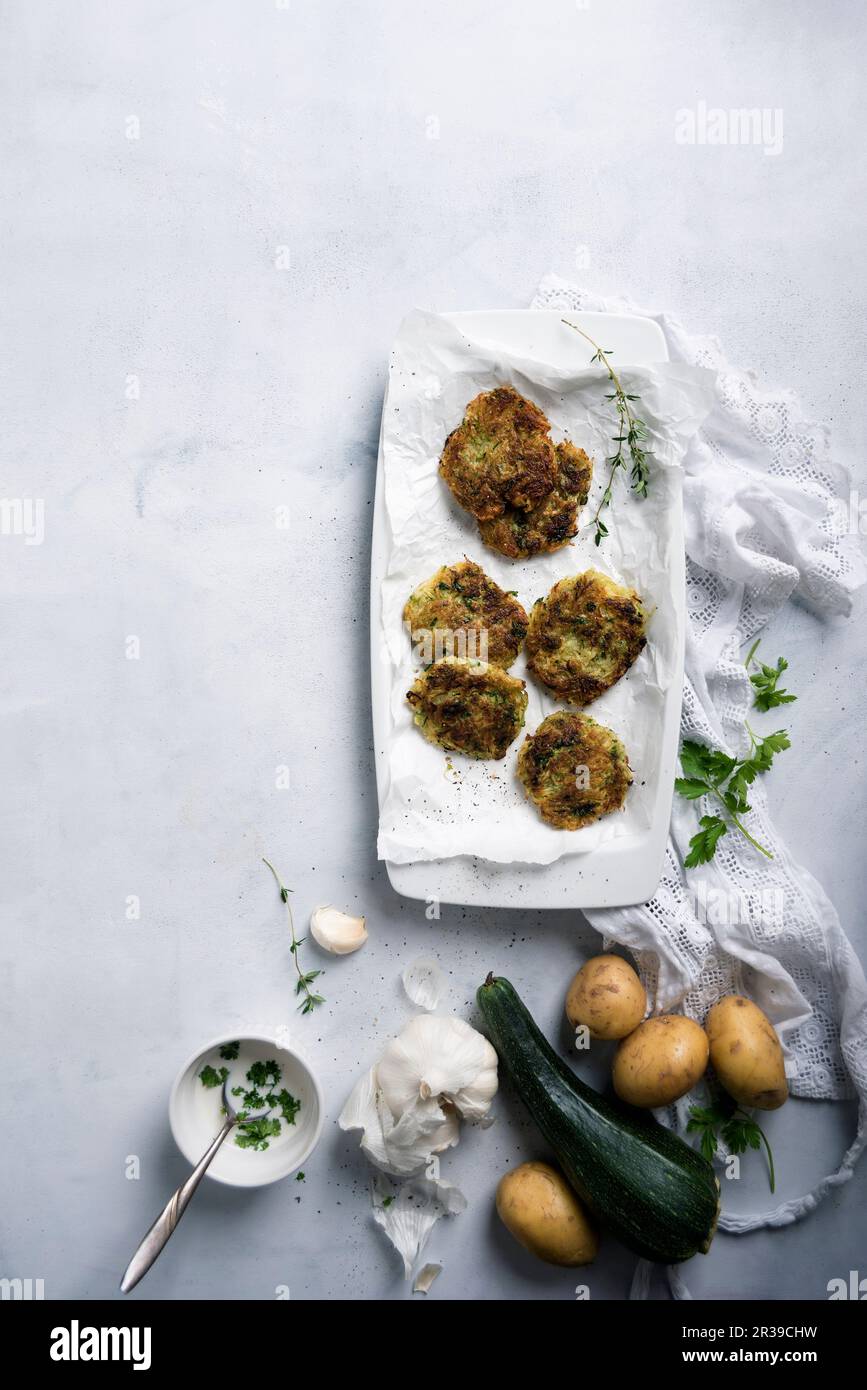 Vegan potato and courgette fritters Stock Photo - Alamy