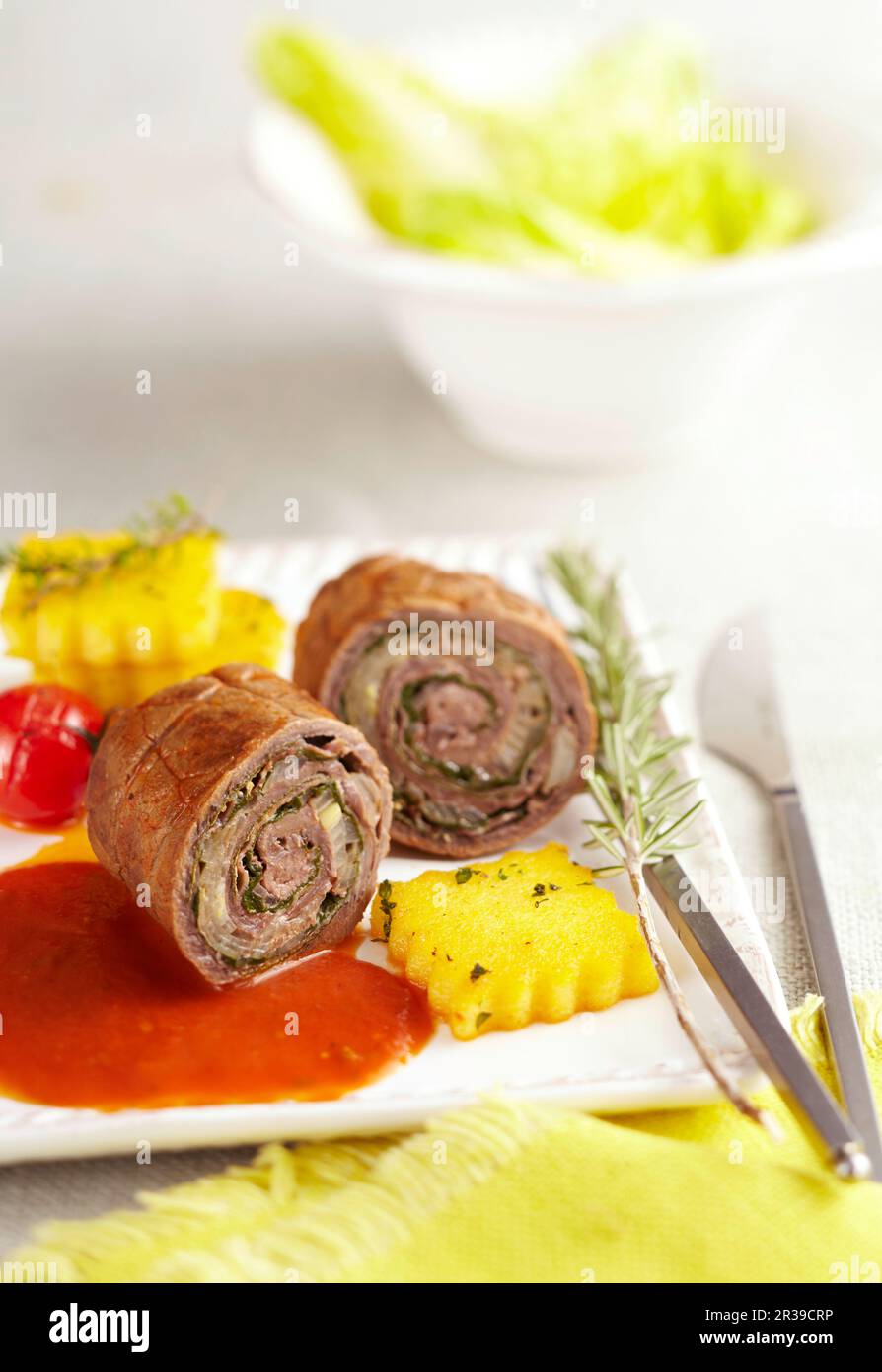 Italian beef roulade with polenta and tomato sauce Stock Photo - Alamy