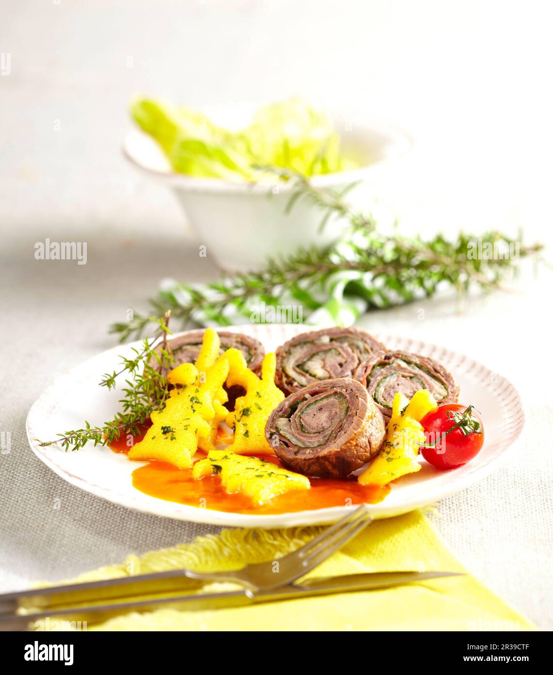 Italian beef roulade with polenta rabbits and tomato sauce Stock Photo ...
