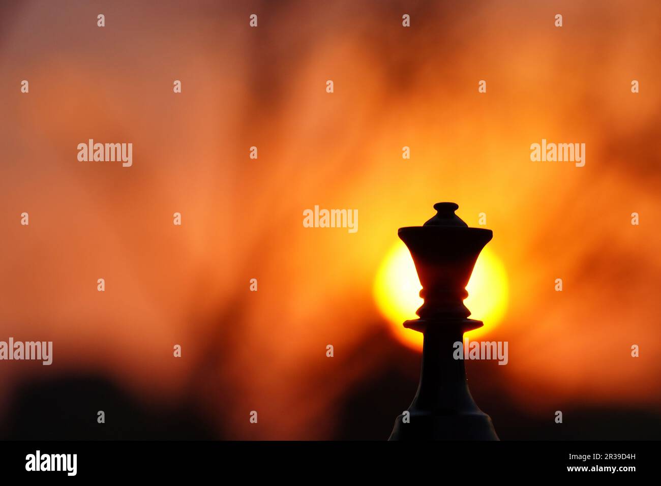 chess pieces on sunset background and golden hour, space for writing ...