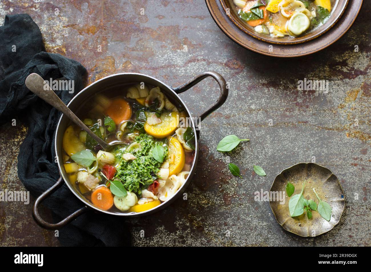 Summer minestrone soup with squash, carrot, tomatoes, basil pesto ...