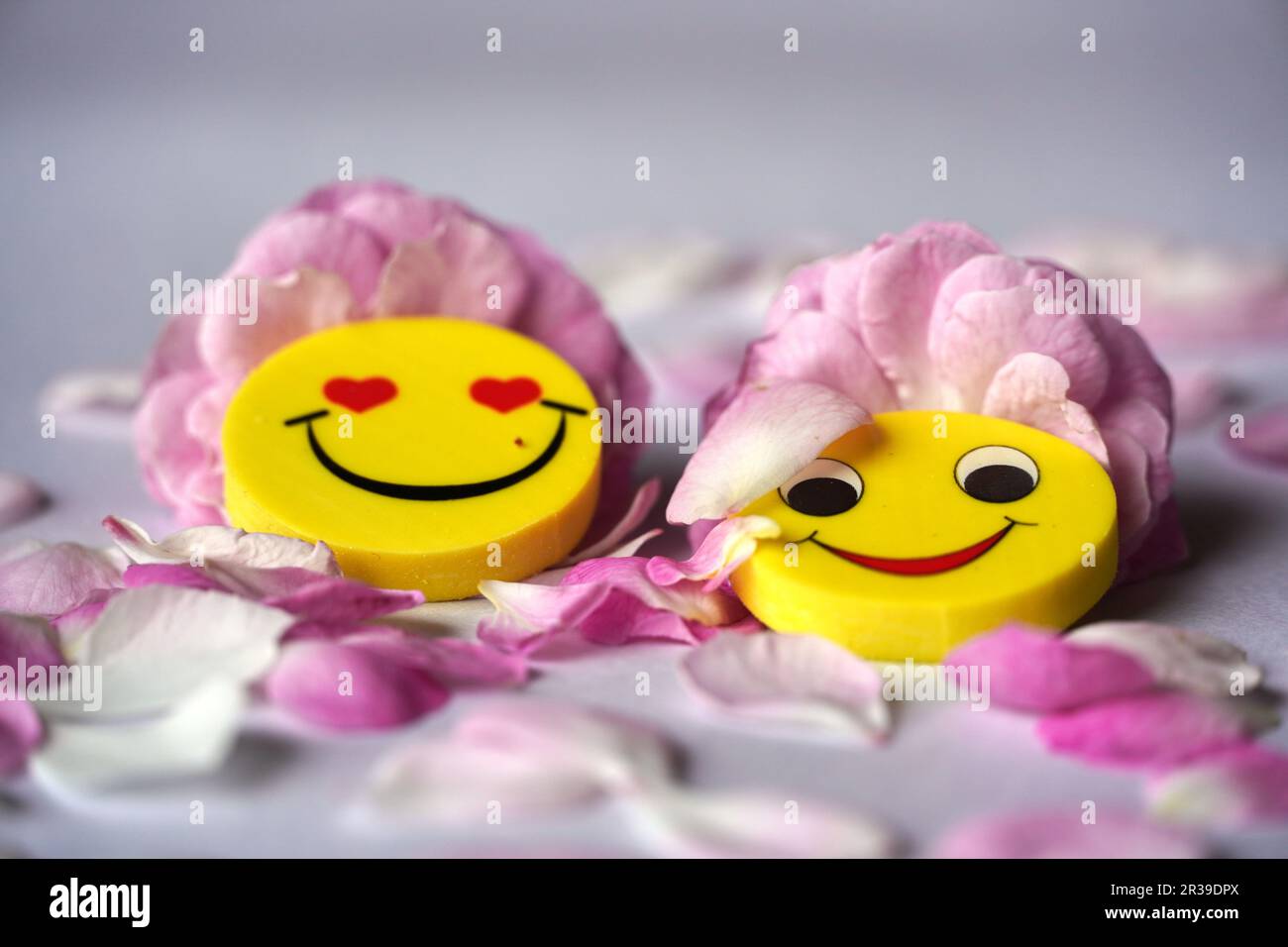 These are Emojis. Cute faces sad,happy faces. pink flower background ...