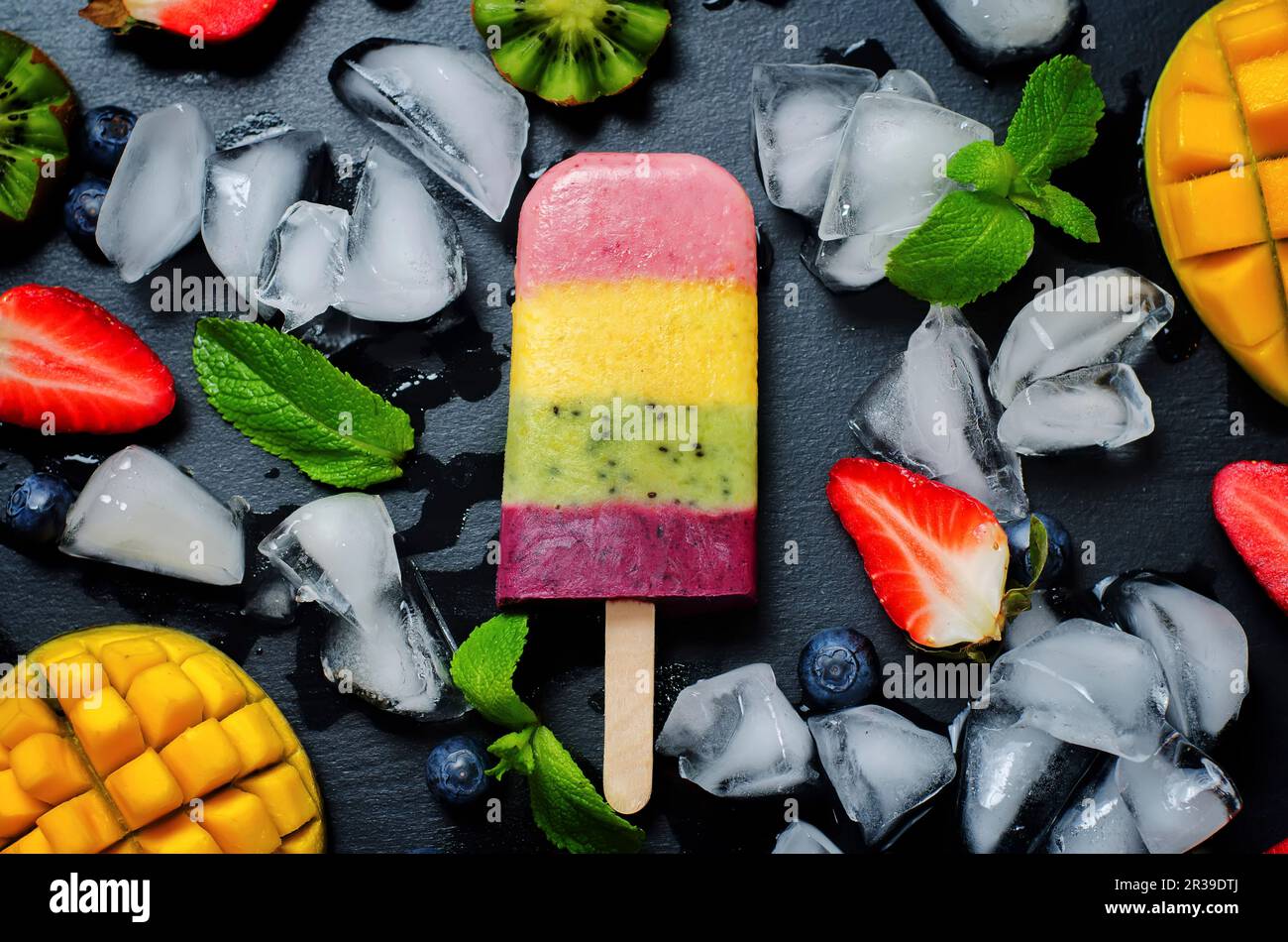 Strawberry, mango, kiwi and blueberry ice cream pop with fruits Stock ...