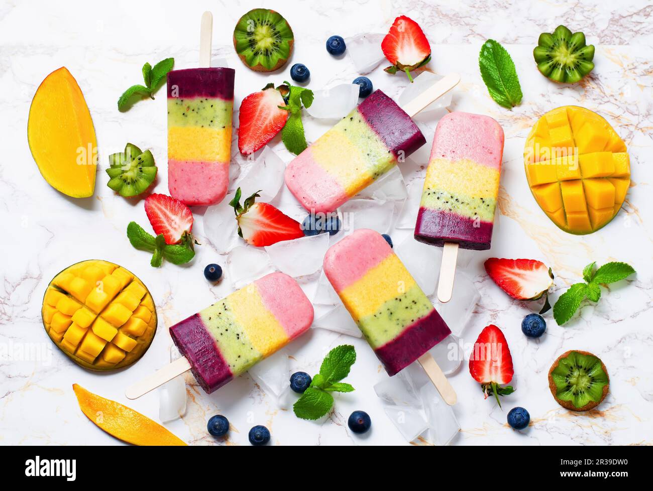Strawberry, mango, kiwi and blueberry ice cream pops with fruits Stock ...