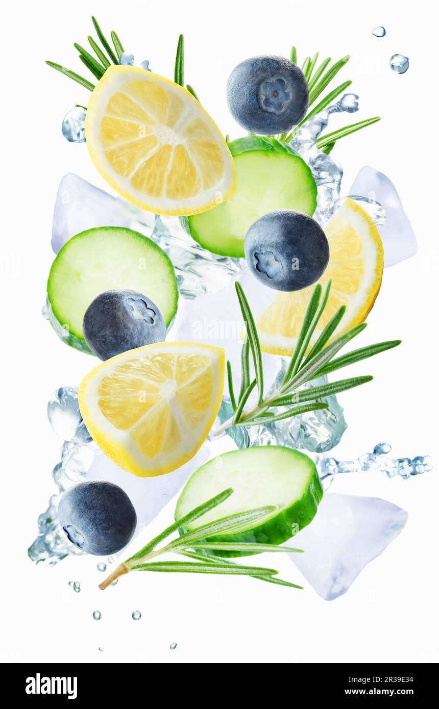 Lemon, cucumber, blueberry and rosemary flying with ices and water ...