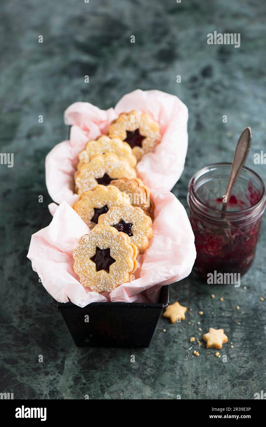 Nutty shortcrust jam sandwich biscuits Stock Photo - Alamy