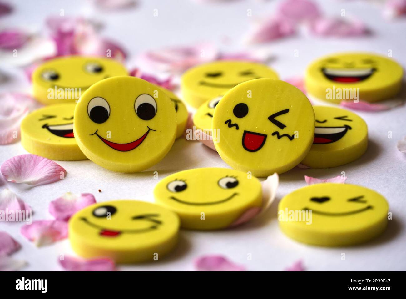 These are Emojis. Cute faces sad,happy faces. pink flower background ...