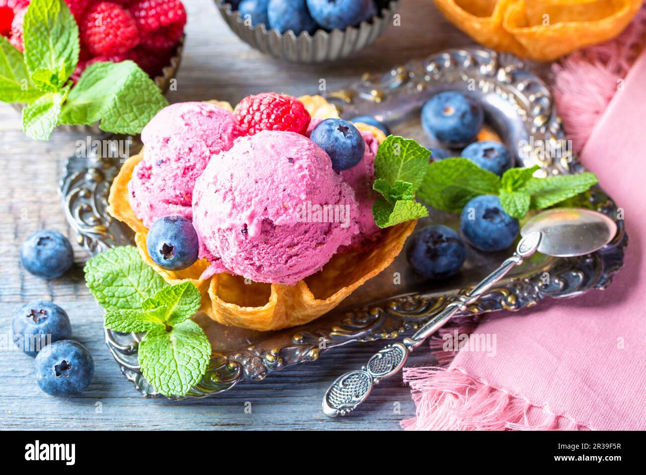 Homemade ice cream with blueberry and raspberries in a wafer bowl Stock ...