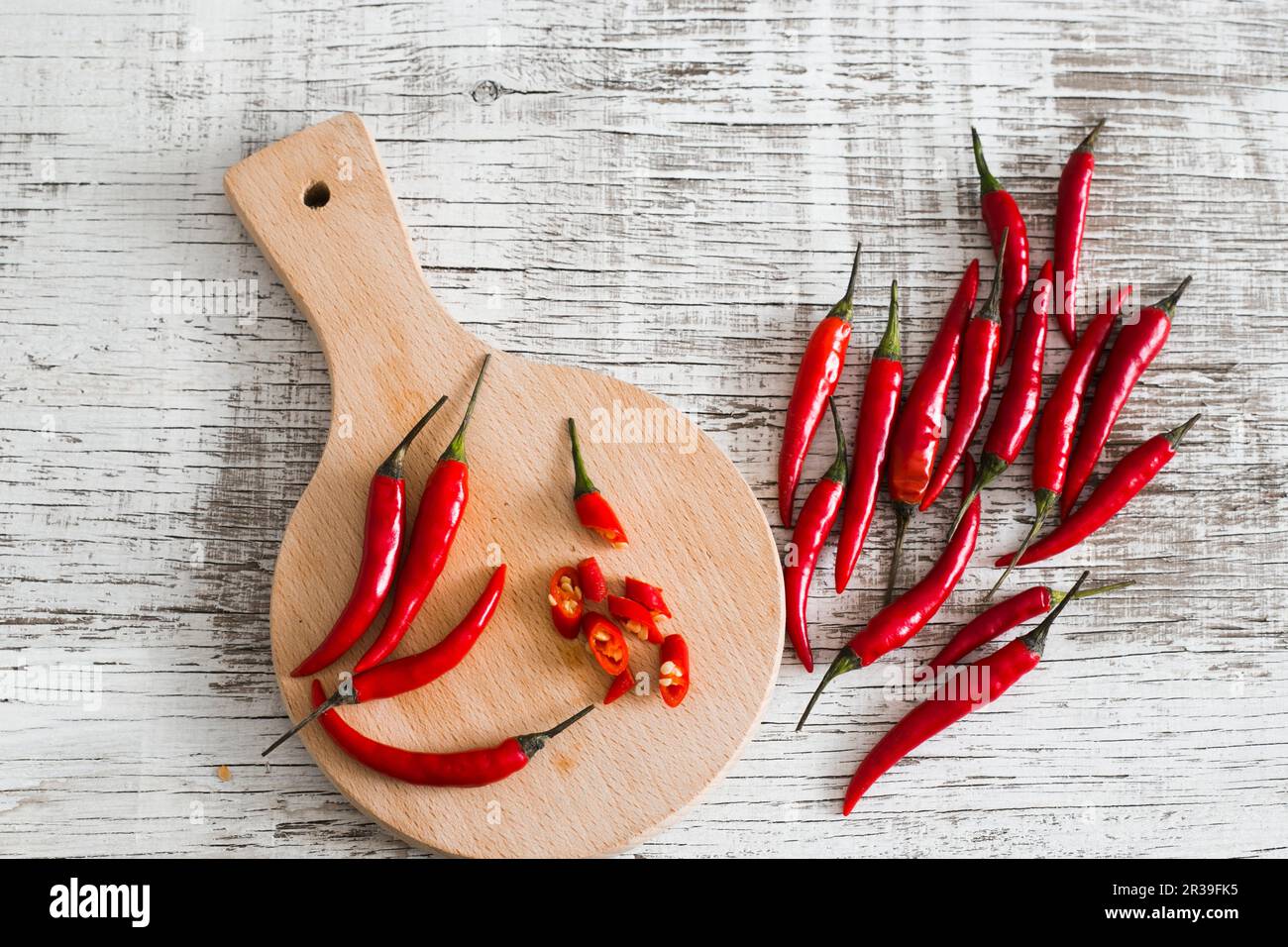 Red chili peppers, whole and cut Stock Photo - Alamy