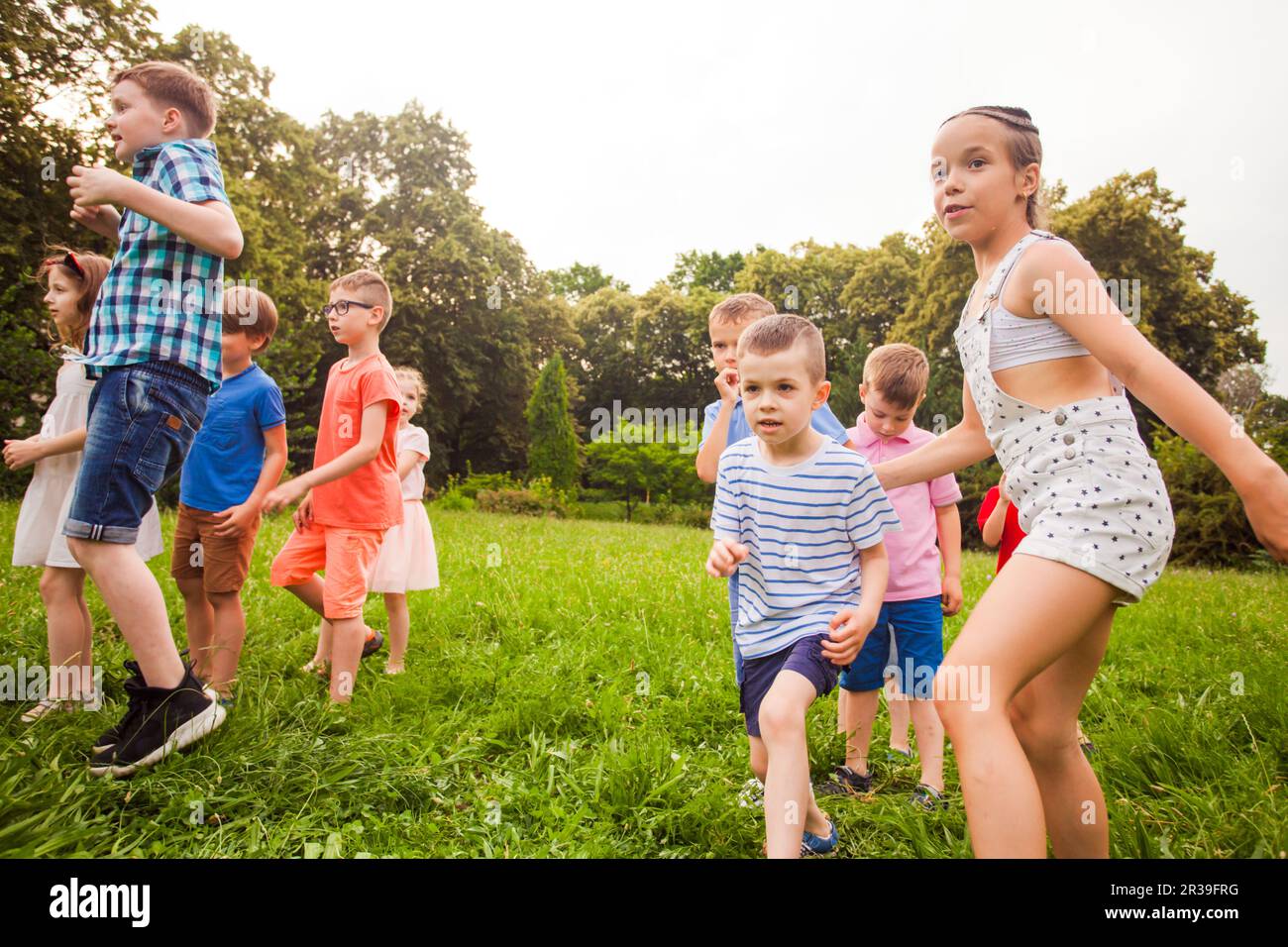 Kids playing funny games in a park in summer time Stock Photo - Alamy