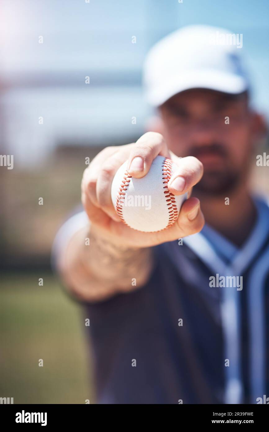 Hand holding baseball, closeup and man for sports, field and training ...