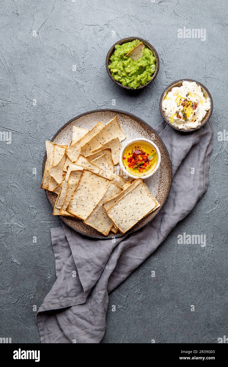 Bran chips, avocado guacamole, olive oil with spices, cream cheese ...