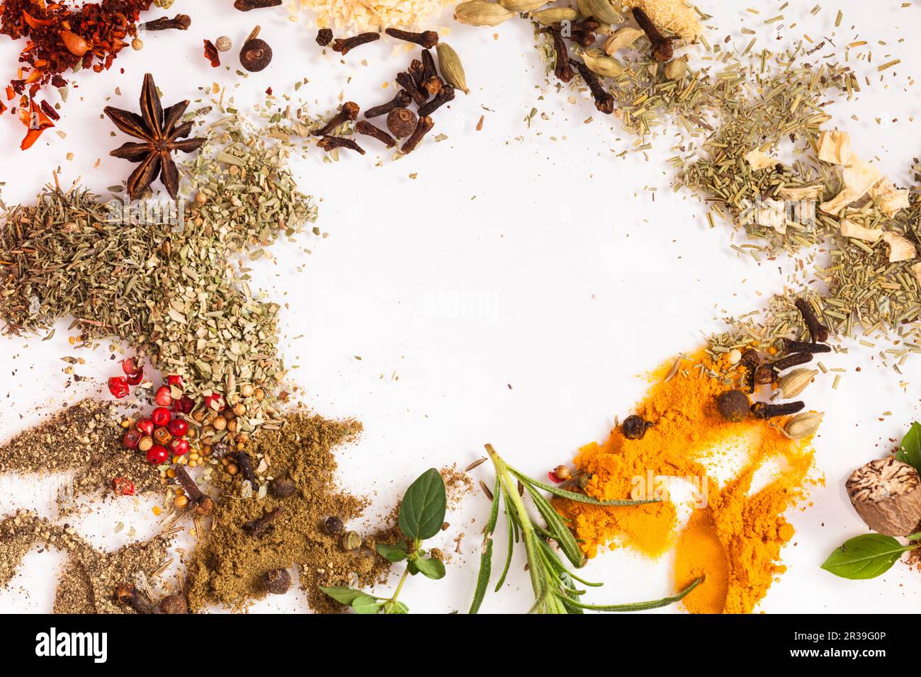 Art composition with different aromatic spices on white background ...