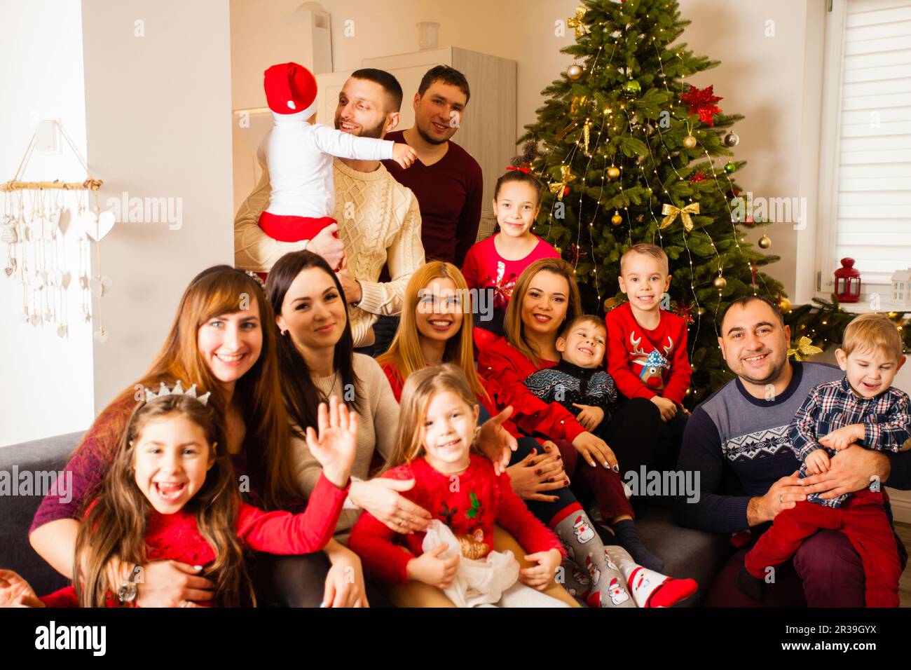 Friends celebrating christmas party happy hi-res stock photography and ...
