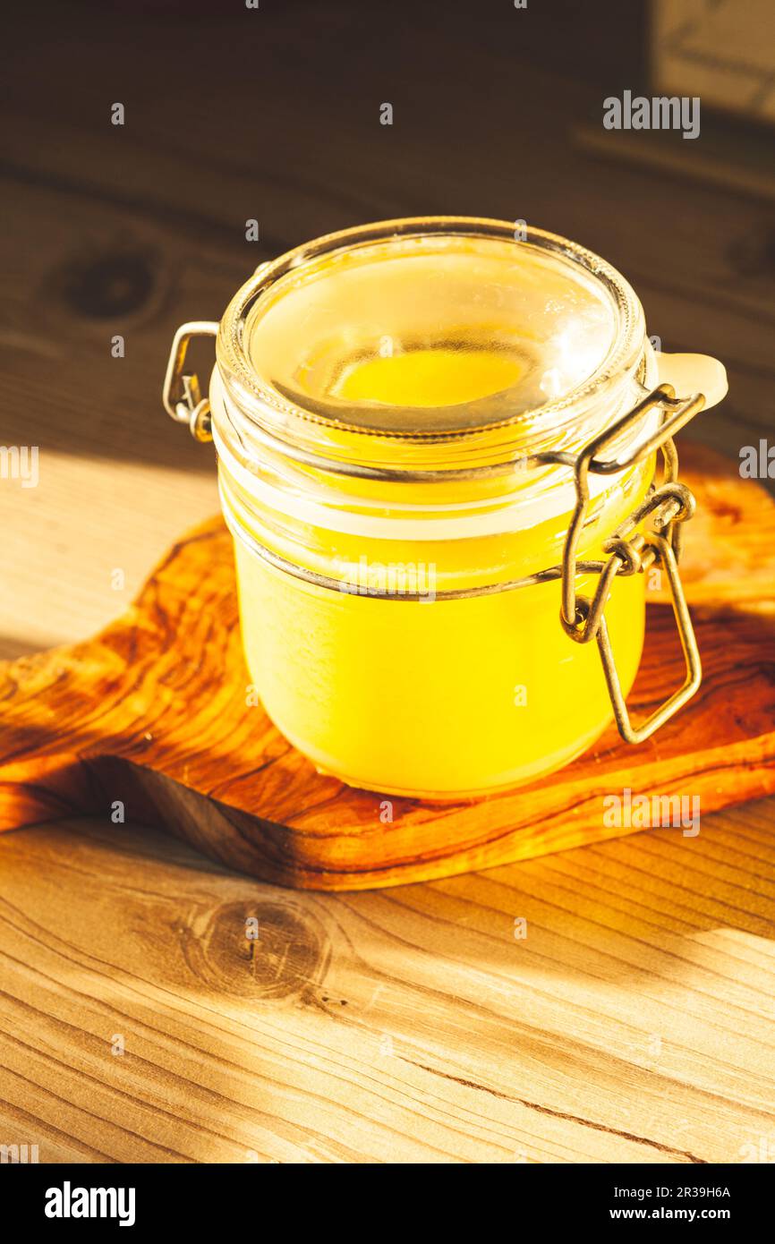 Glass jar with ghee - clarified butter in jar Stock Photo - Alamy