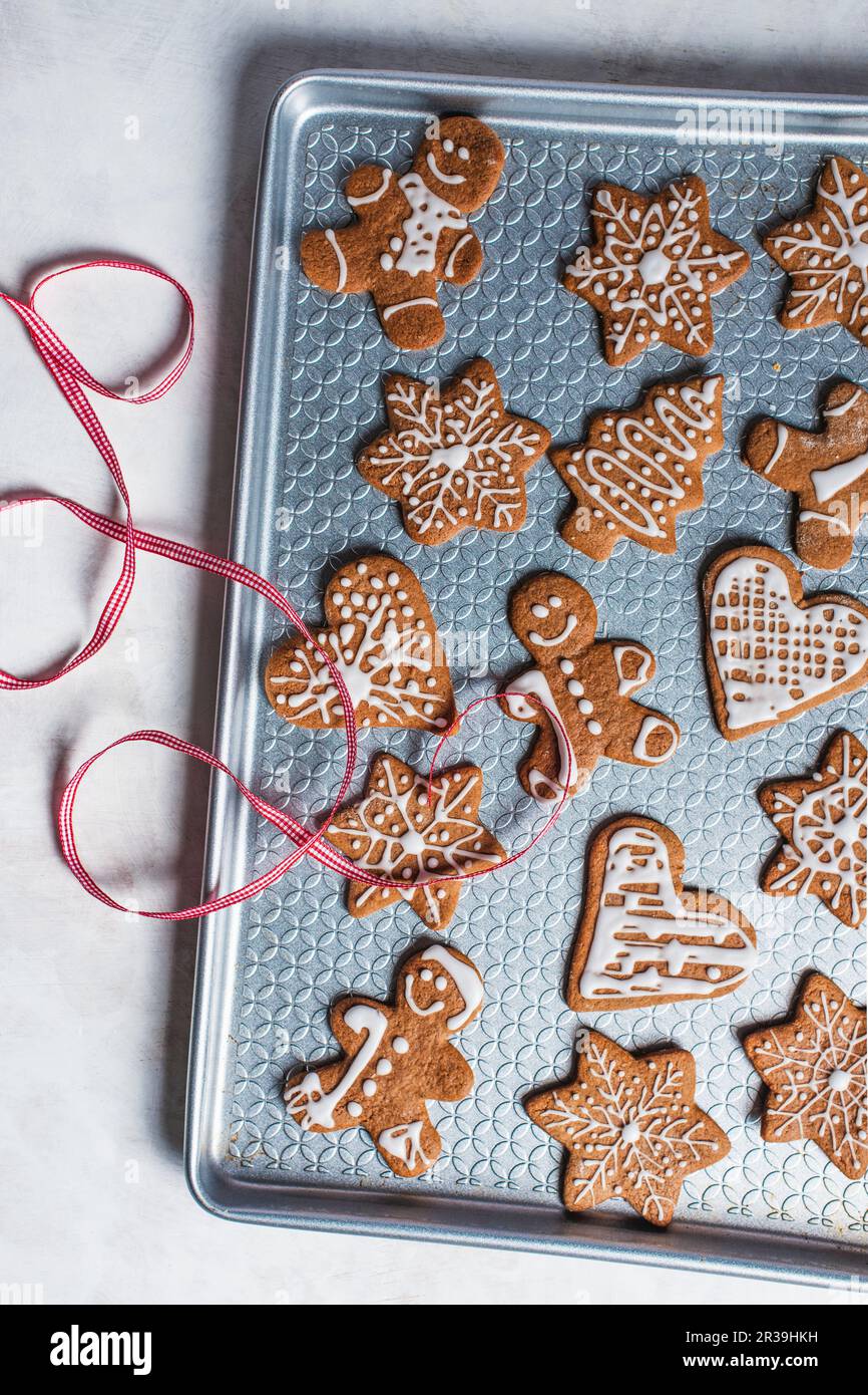 Gingerbread biscuits with sugar icing for Christmas Stock Photo - Alamy