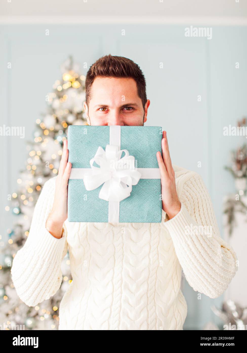 Man holding present box hi-res stock photography and images - Alamy