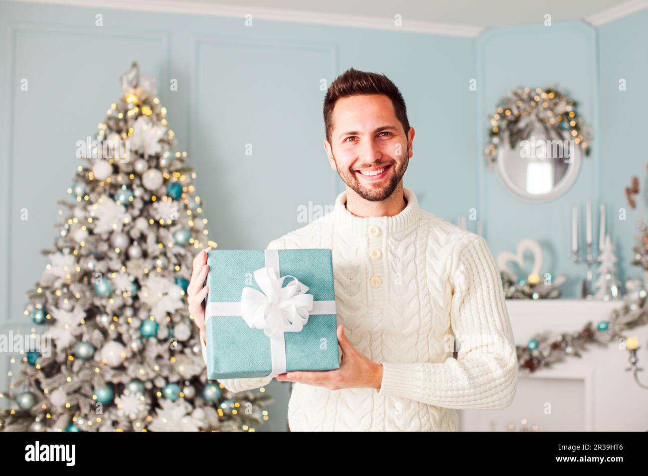 Handsome christmas man posing in hi-res stock photography and images ...