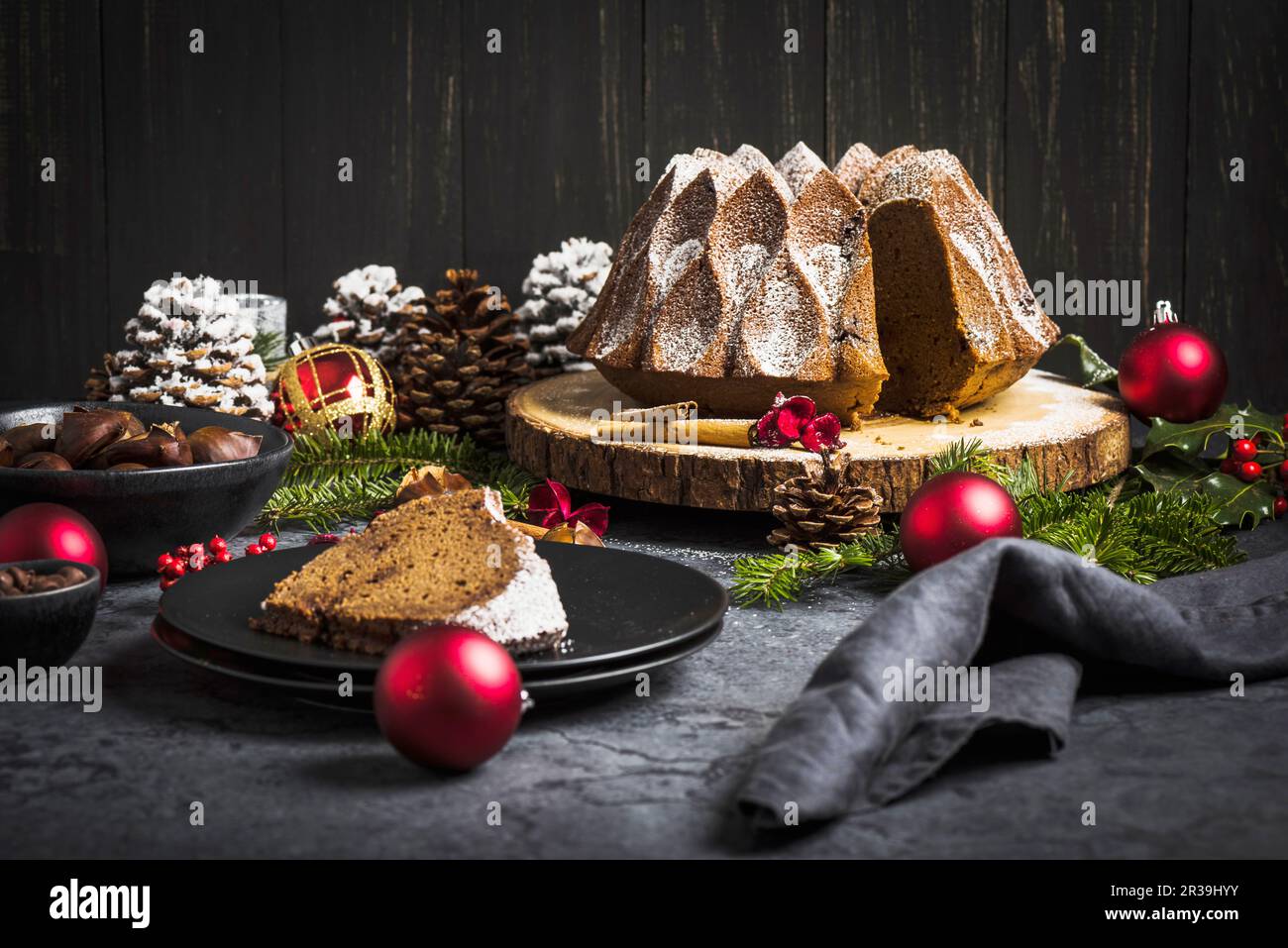 Christmas chestnut and chocolate cake on a tree bark disc Stock Photo ...