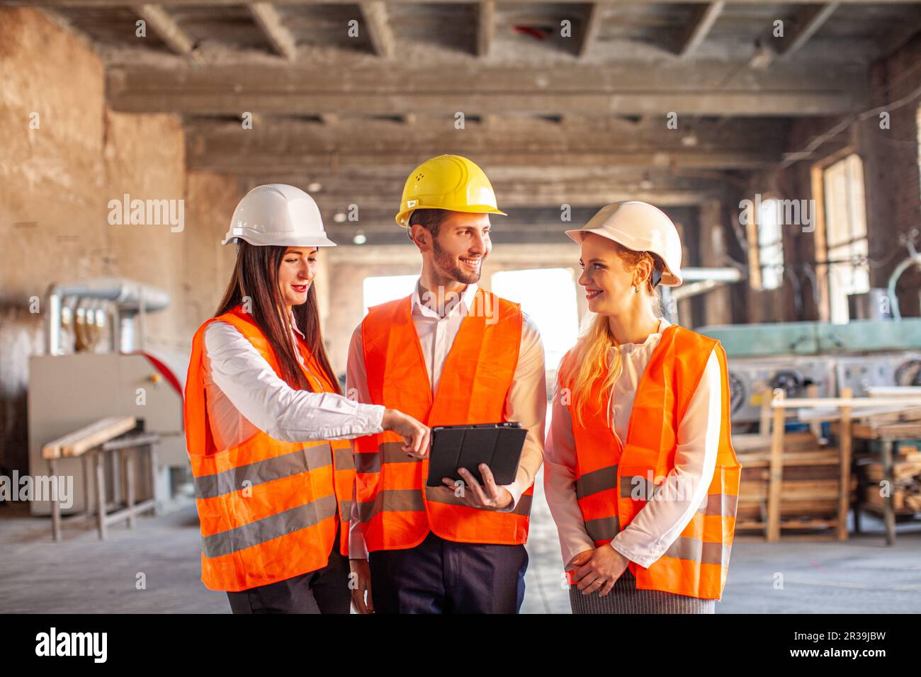Engineers wearing safety helment meeting and discuss for work planning ...