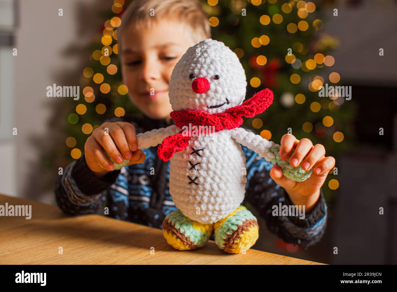 The beautiful small boy has a New Year's puppet show Stock Photo - Alamy