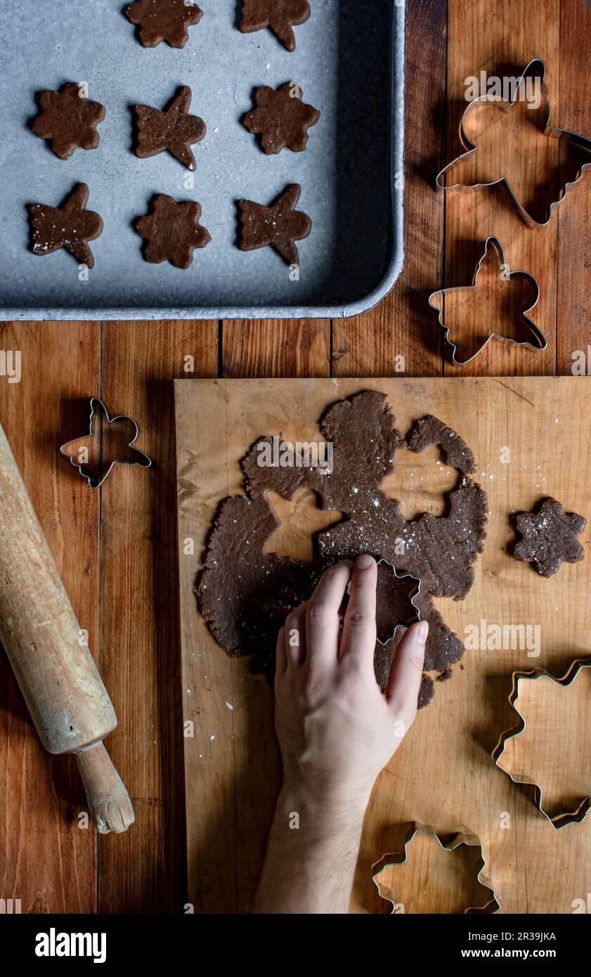 Person preparing gingerbread cookies hi-res stock photography and ...