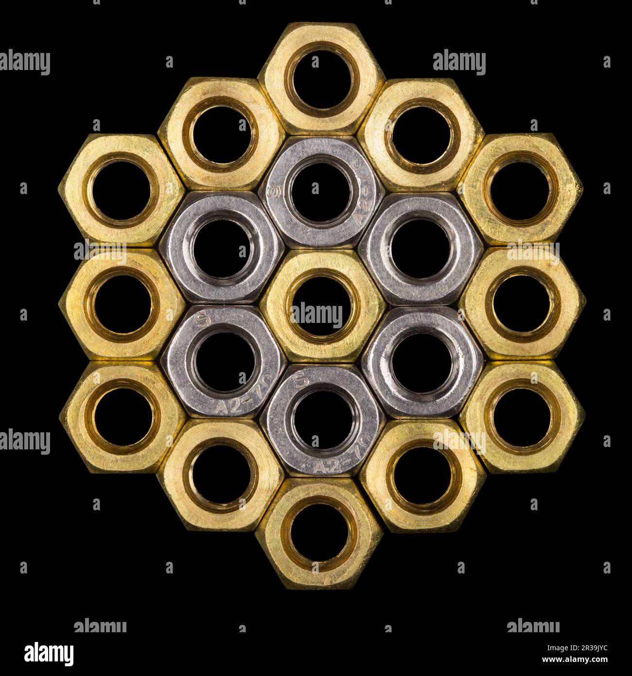 Metallic hex nuts layed out in a hexagonal pattern, industrial theme ...