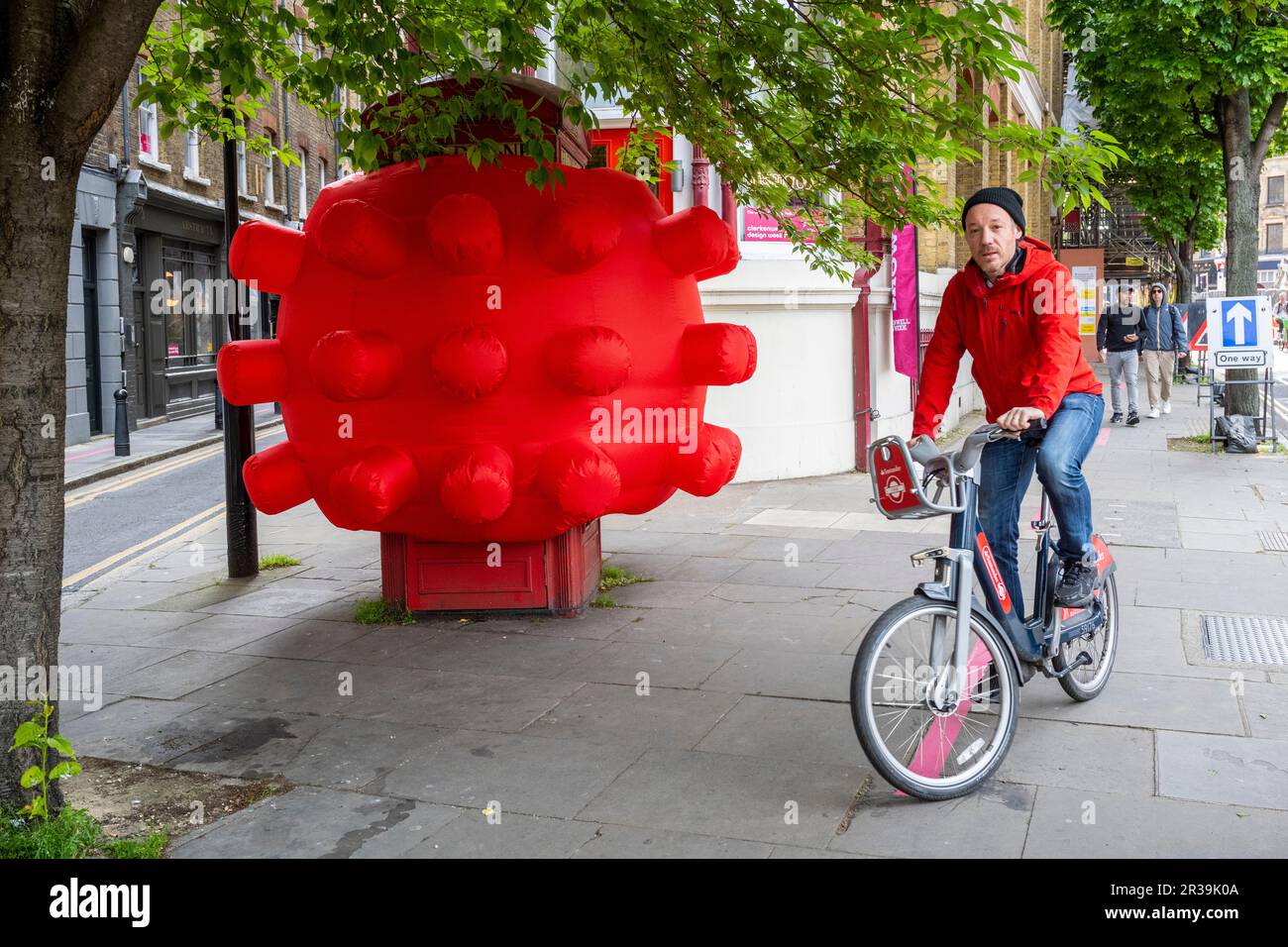 London, UK. 23 Mary 2023. A cyclist passes British artist Steve Messam ...