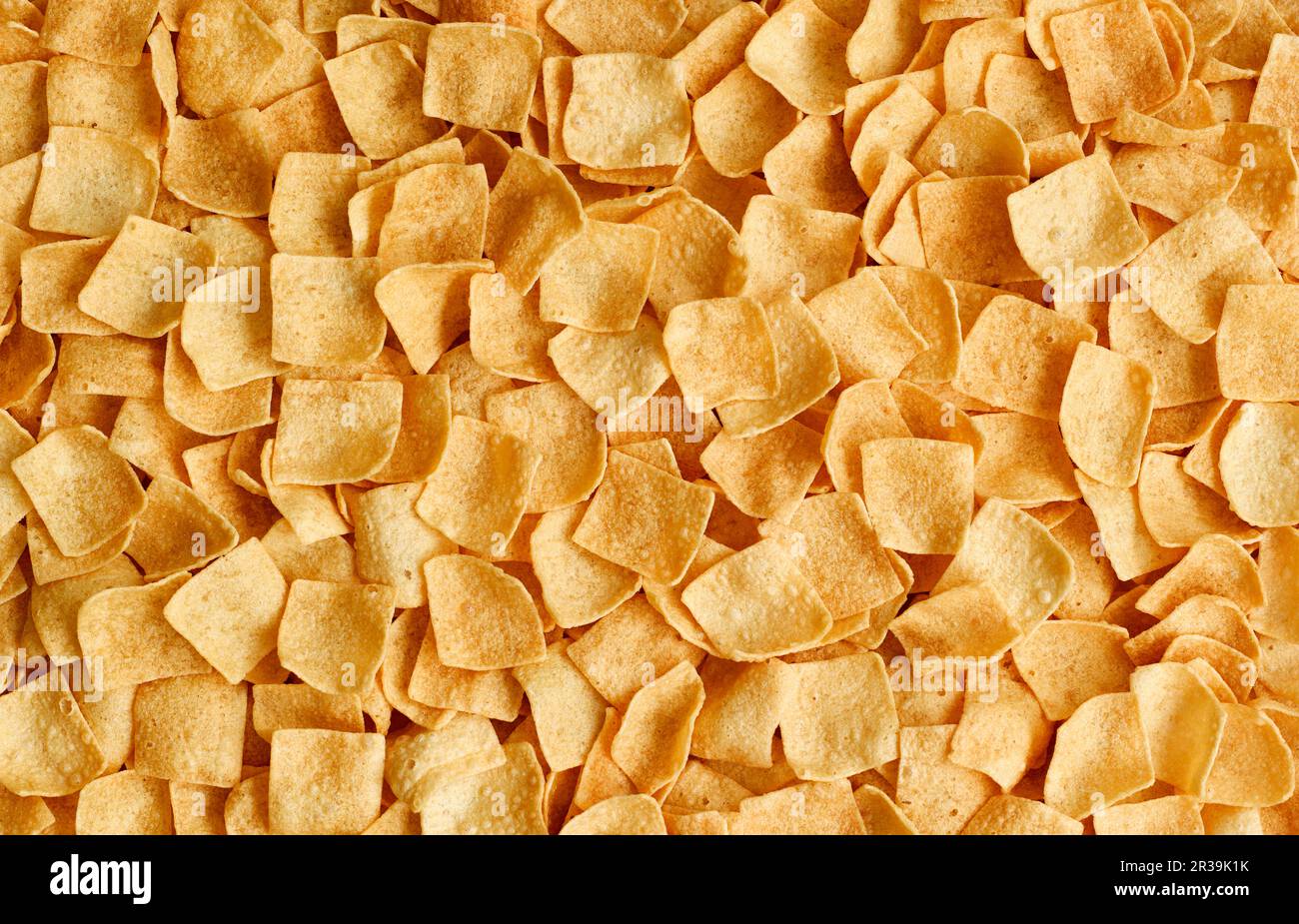 Salted potato squares (potato snacks, edge to edge Stock Photo - Alamy