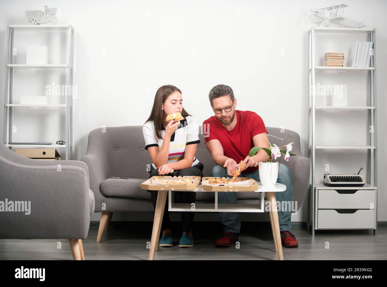 Business people having pizza for lunch. Coworkers couple enjoying pizza ...