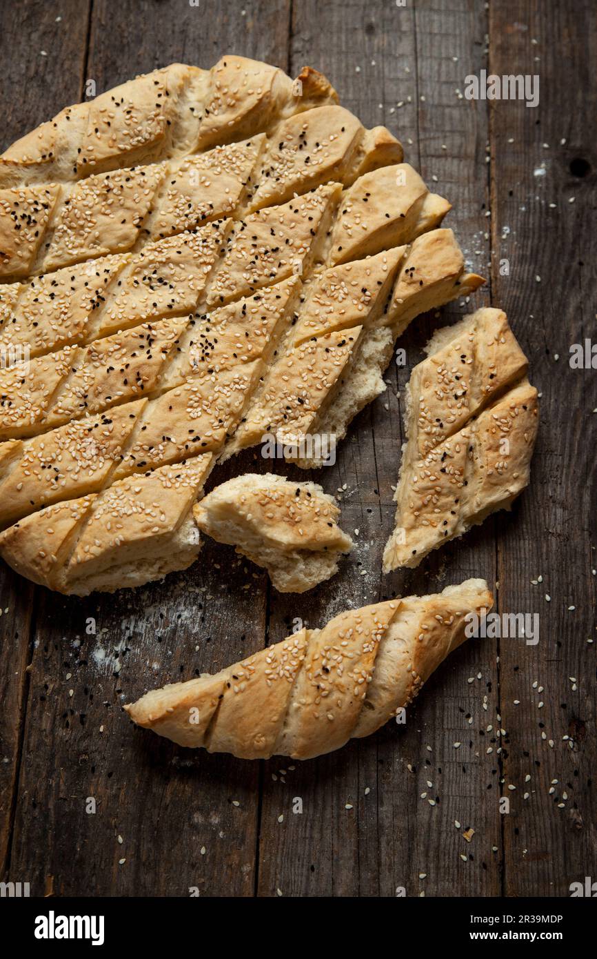 Unleavened bread with sesame seeds and black caraway, broken Stock ...