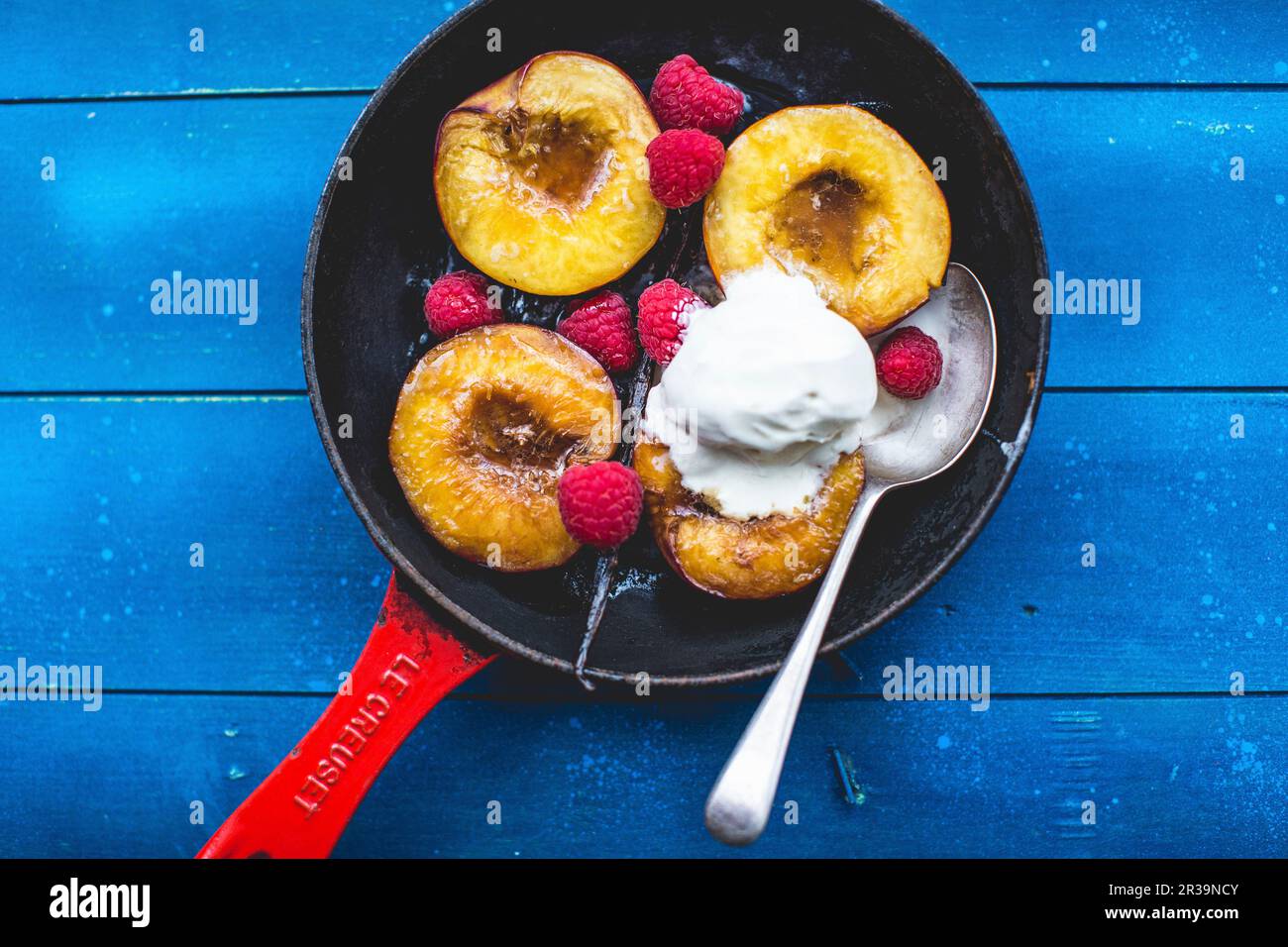 Peach melba with raspberries Stock Photo - Alamy