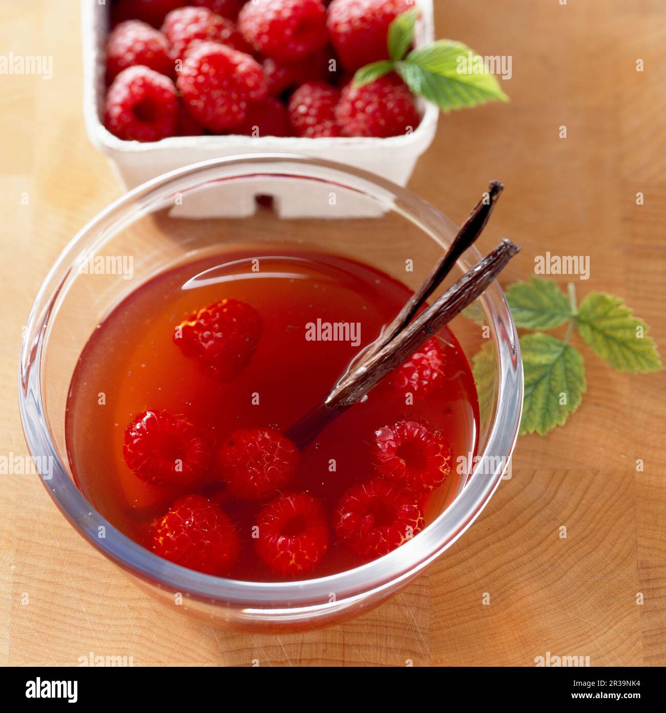 Homemade raspberry vinegar with vanilla and fresh berries Stock Photo ...